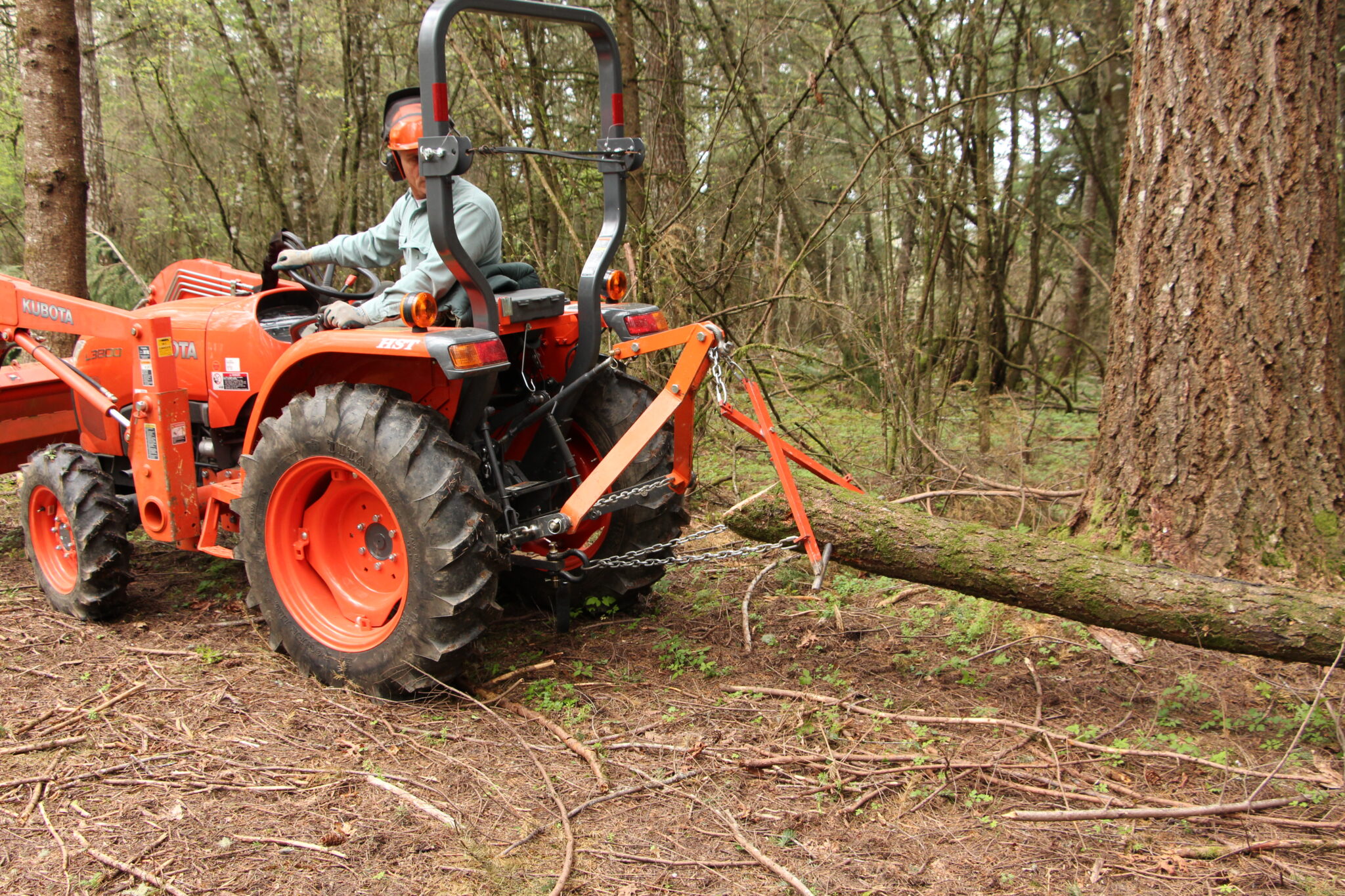 Hands-free tractor log skidder attachment - Small Wood Lot Tools